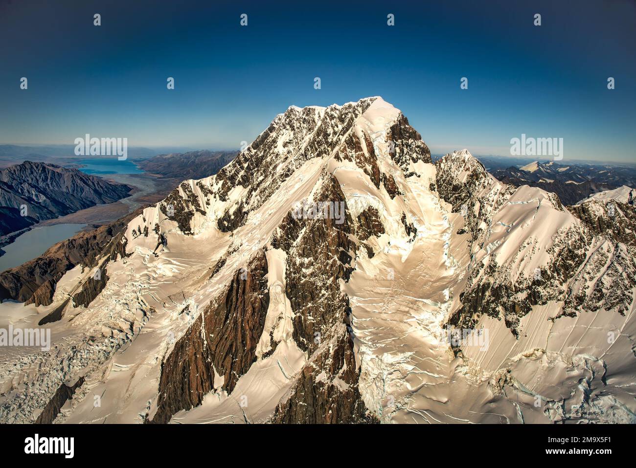 Looking down on the snow capped peak of Aoraki Mount Cook with the ...