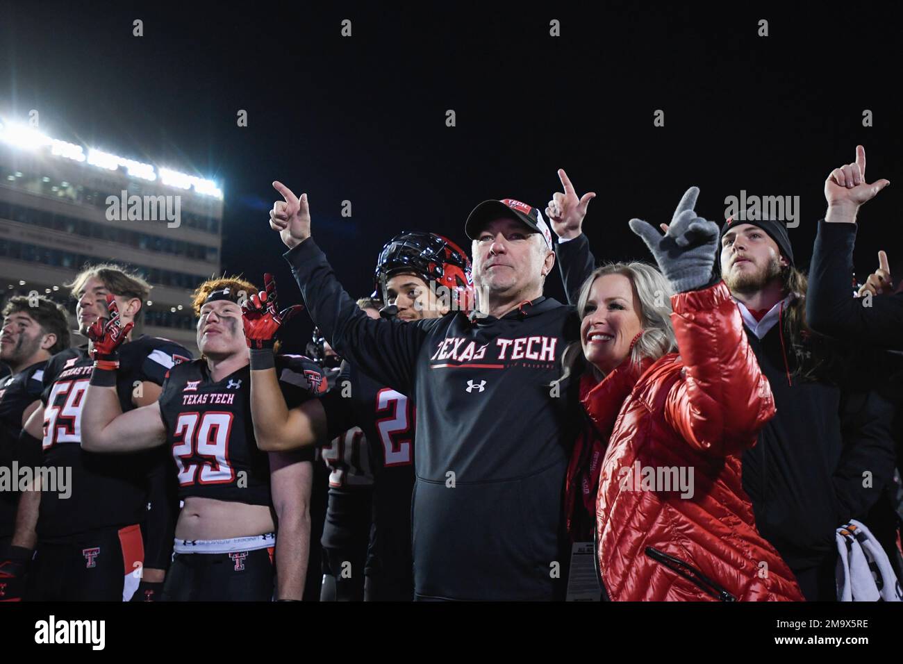 Texas Tech head coach Joey McGuire hugs his wife Debbie McGuire after ...