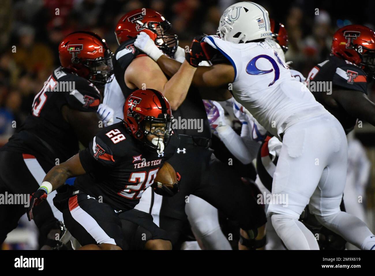 Texas Tech running back Tahj Brooks (28) runs the ball against Kansas ...