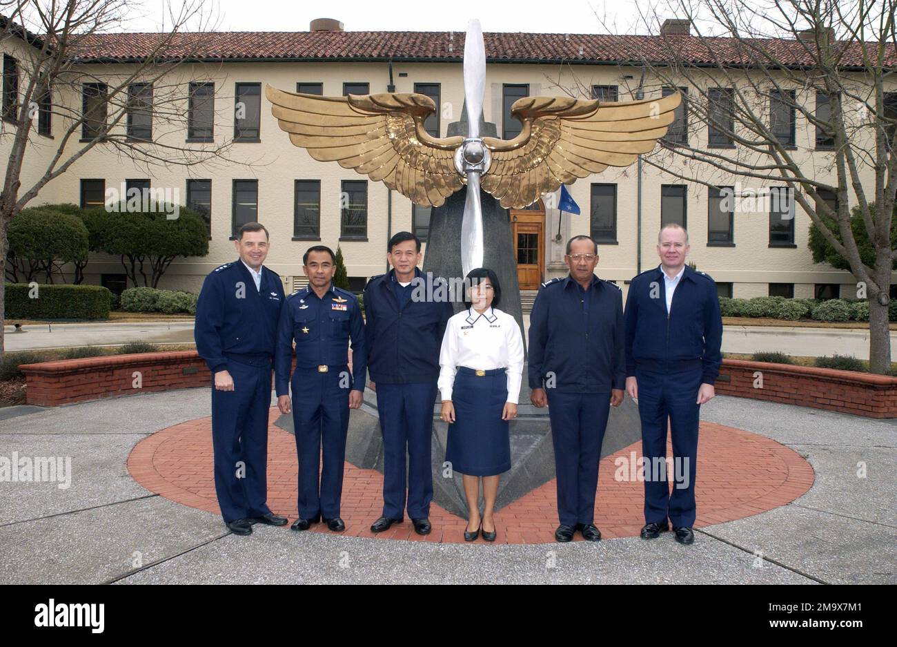 040406-F-4169T-018. [Complete] Scene Caption: Standing in front of the ...