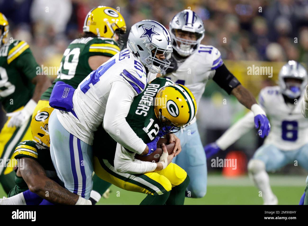 Green Bay Packers quarterback Aaron Rodgers (12) is sacked by Dallas ...