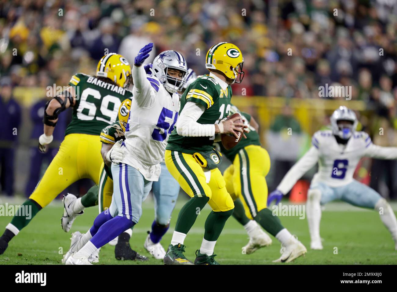 Green Bay Packers quarterback Aaron Rodgers (12) is sacked by Dallas ...