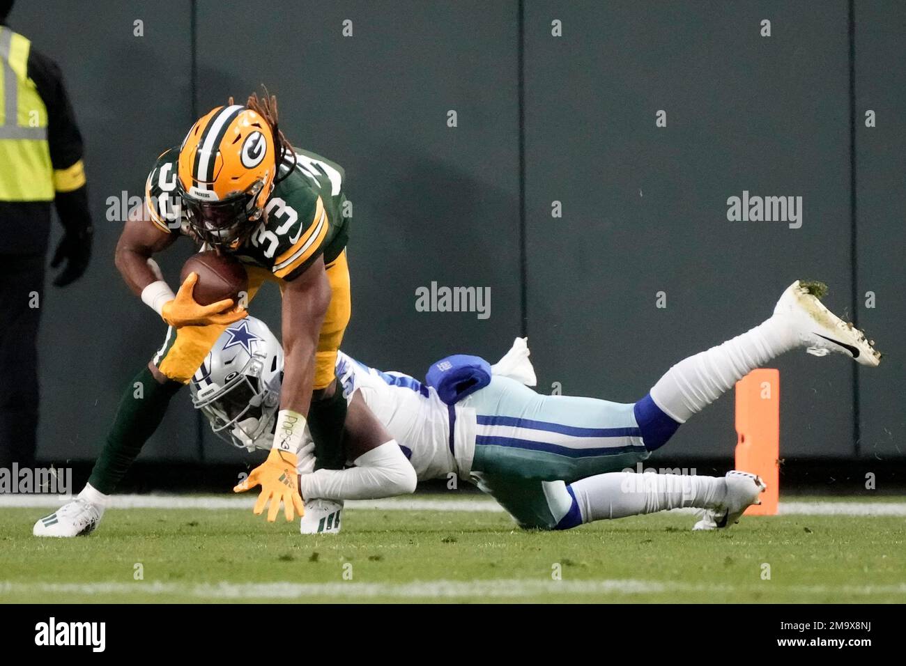 Green Bay Packers running back Aaron Jones (33) is stopped by Dallas ...