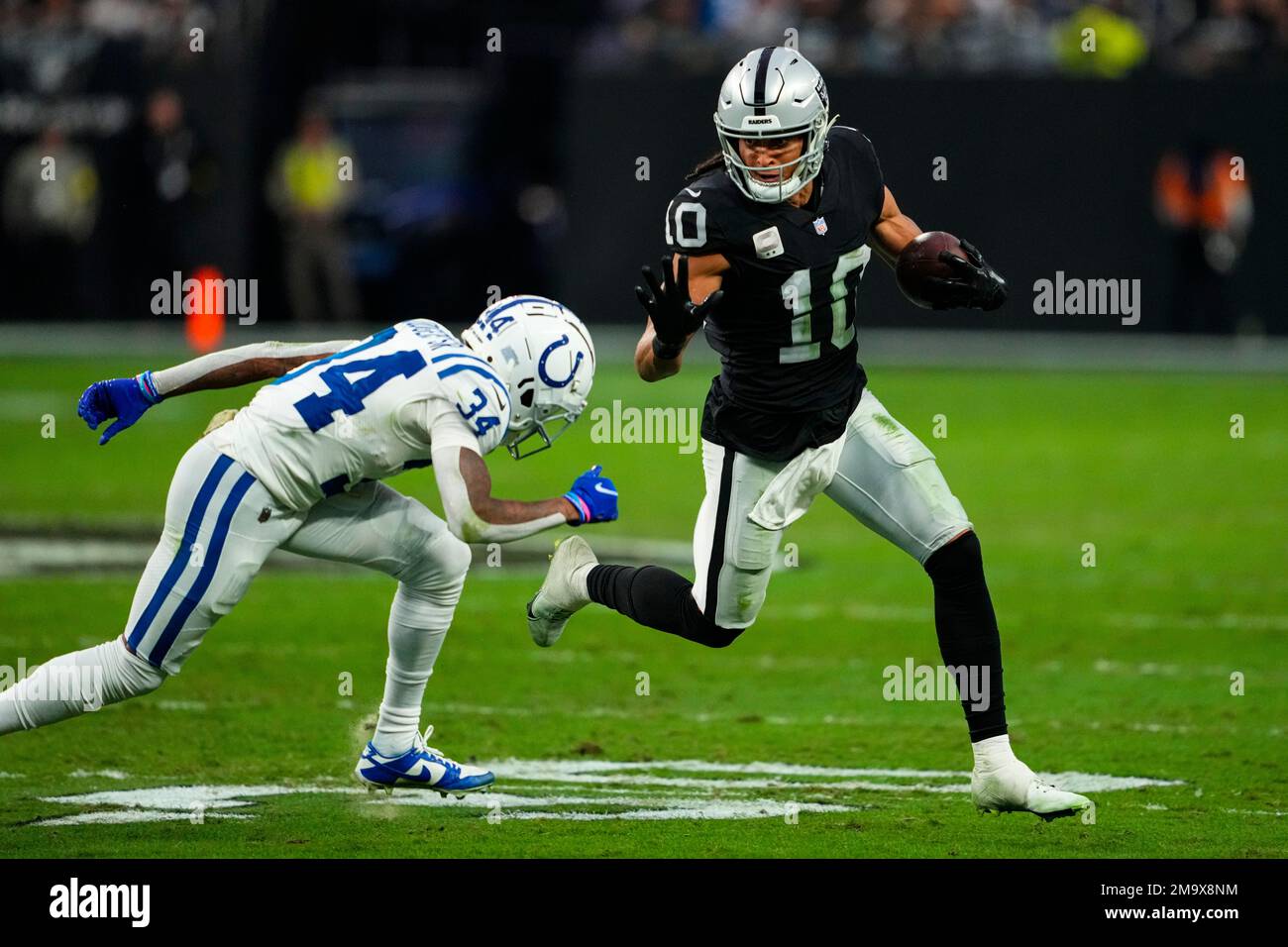 Las Vegas Raiders wide receiver Mack Hollins (10) tries to get past ...