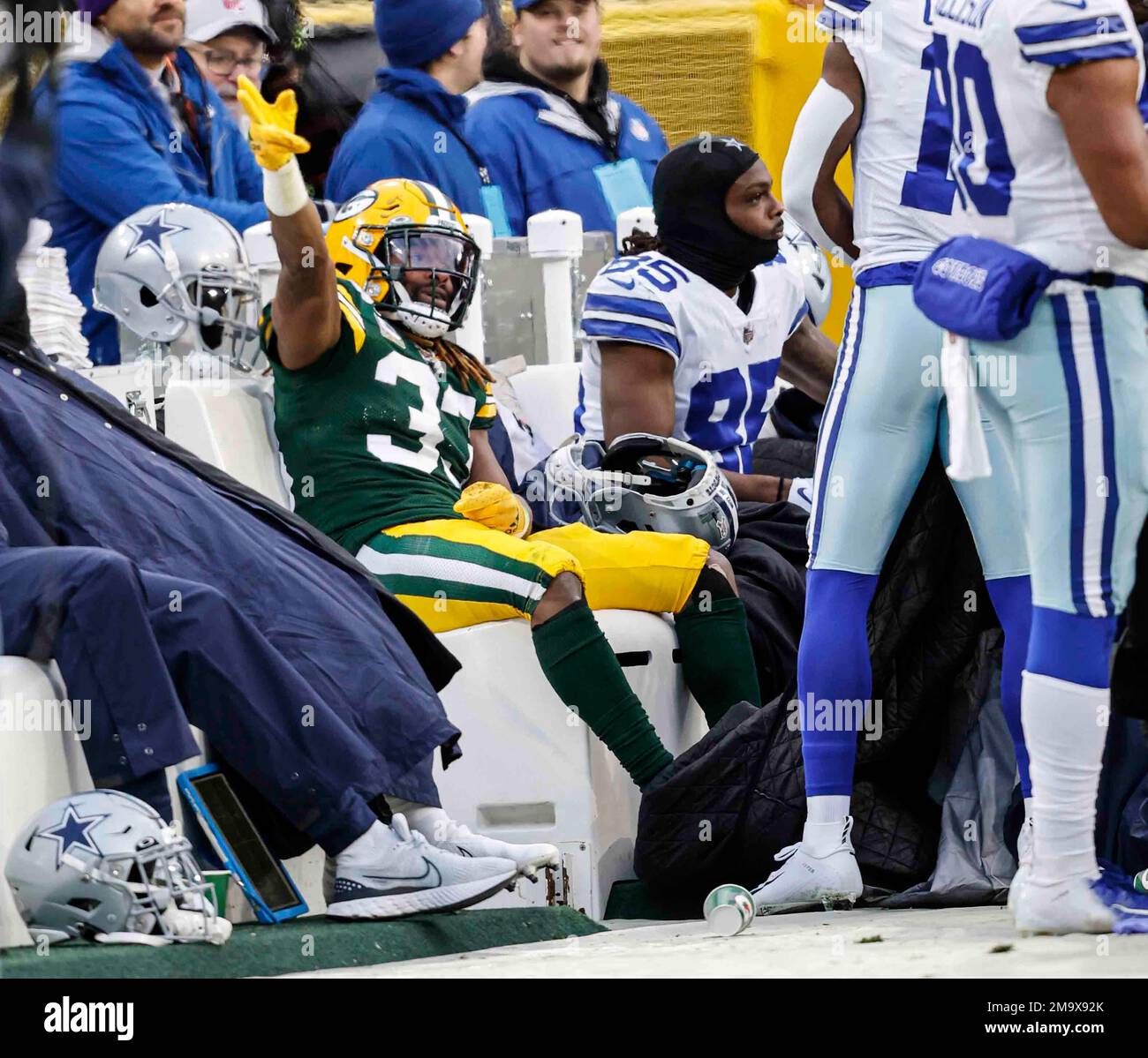 Green Bay Packers running back Aaron Jones (33) ends up on the Dallas ...