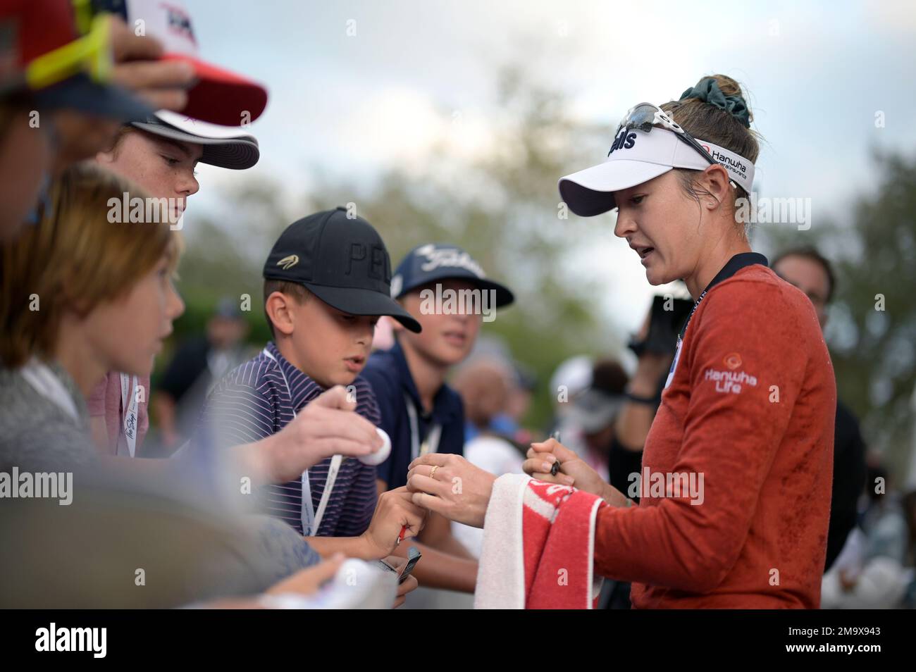Nelly Korda, right, gives autographs to spectators after winning the ...