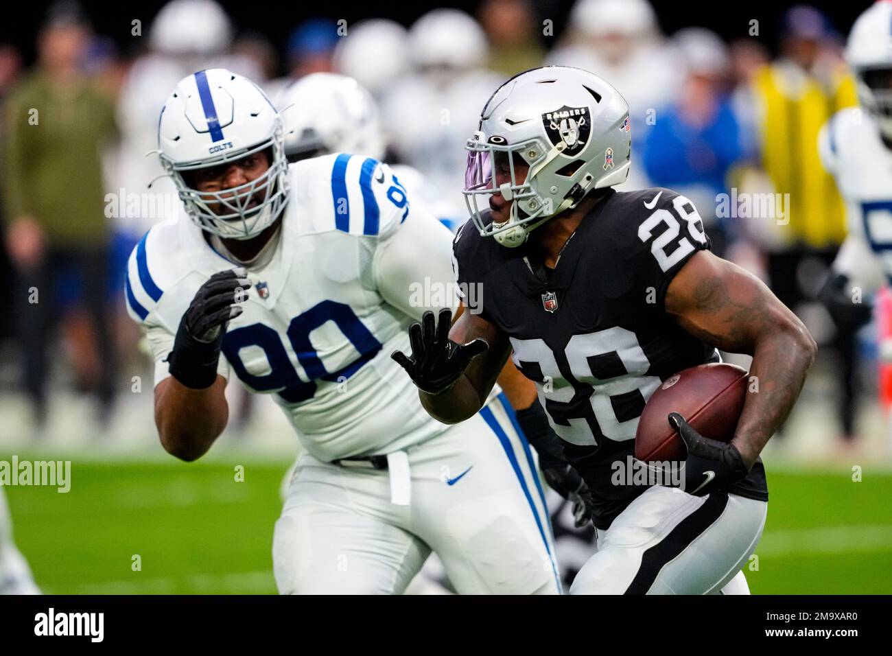 Las Vegas Raiders running back Josh Jacobs (28) tries to get past ...
