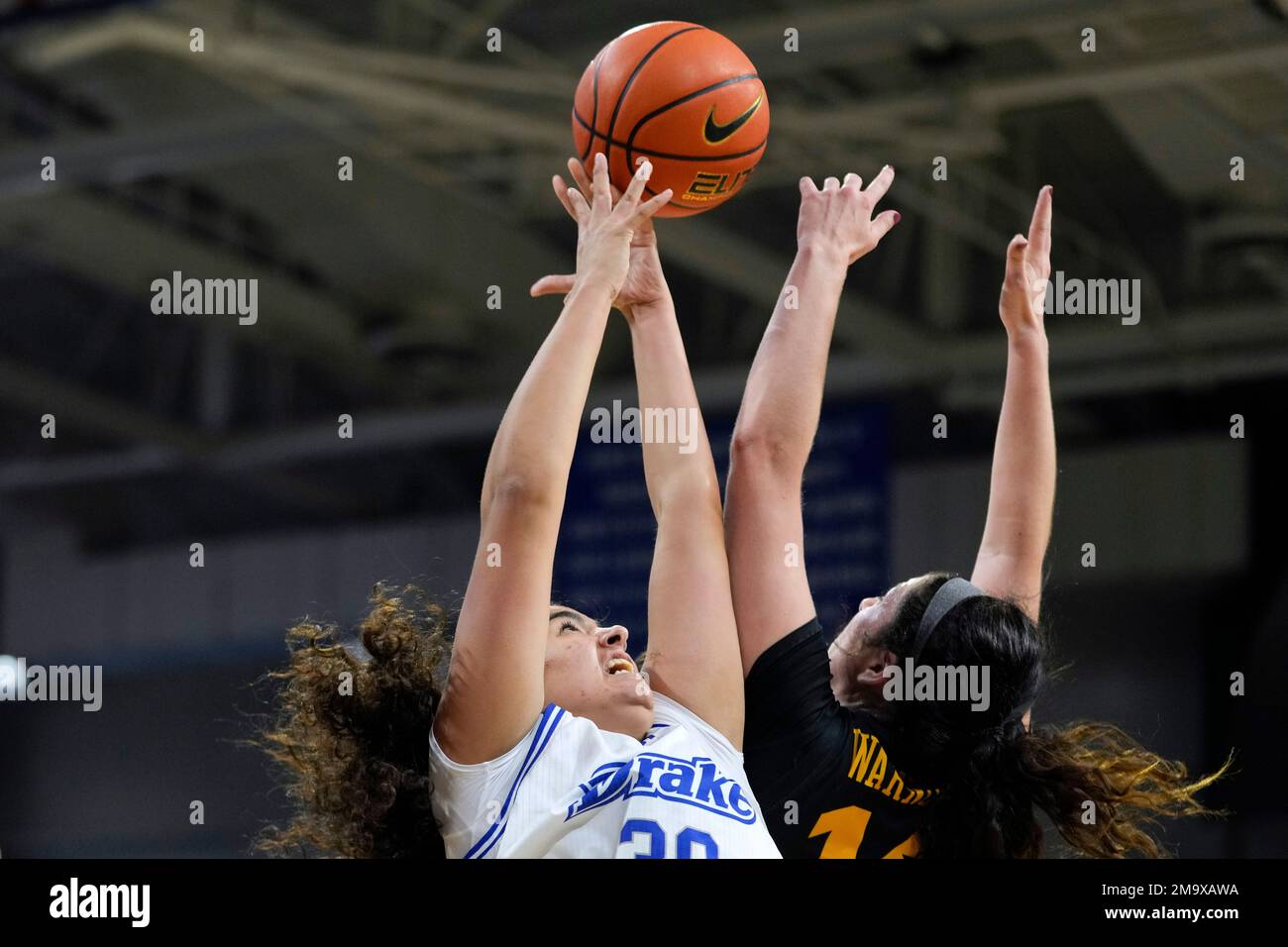 Drake forward Taedyn Gray, left, fights for rebound with Iowa forward ...