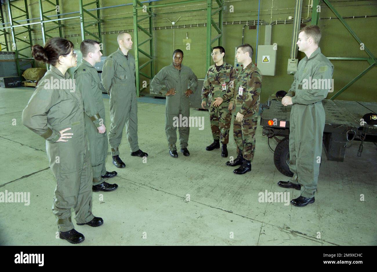 Volunteer simulated astronauts from Lajes Field, Azores, are briefed on ...