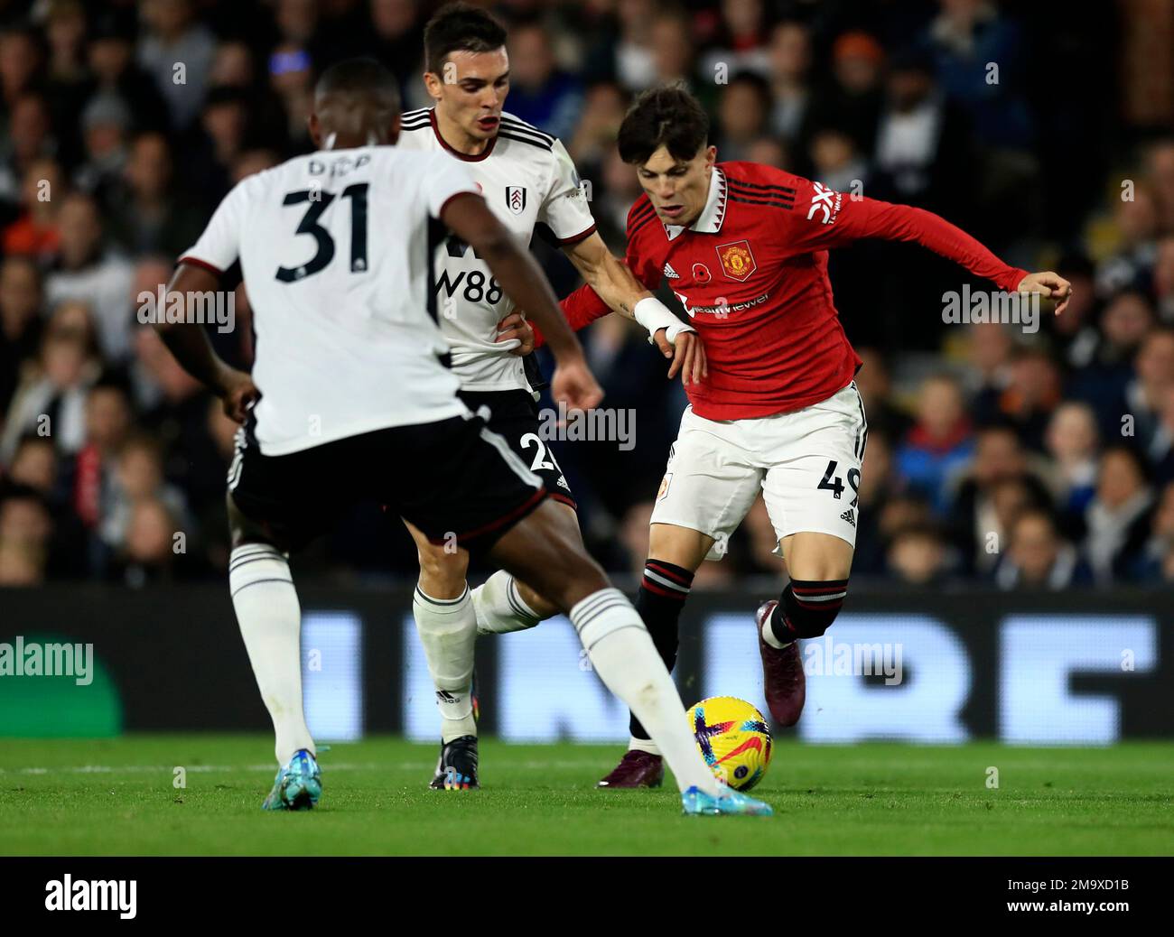 Manchester United's Alejandro Garnacho, right, controls the ball during ...
