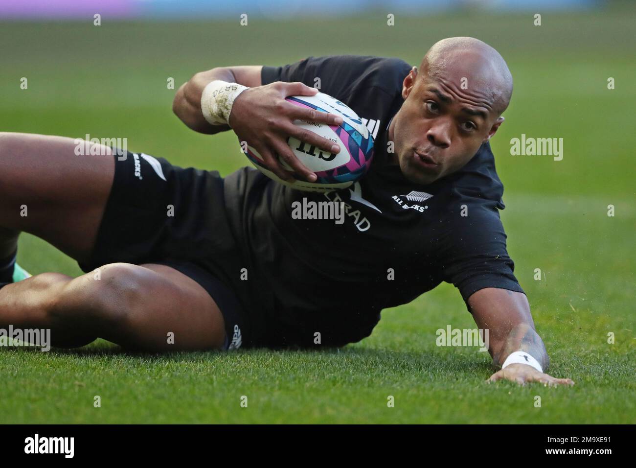 New Zealand's Mark Telea scores a try during the rugby union ...