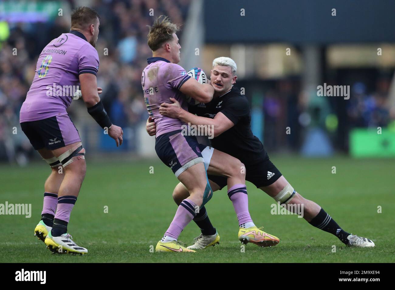 Scotland's Duhan van der Merwe, centre, is tackled by New Zealand's ...