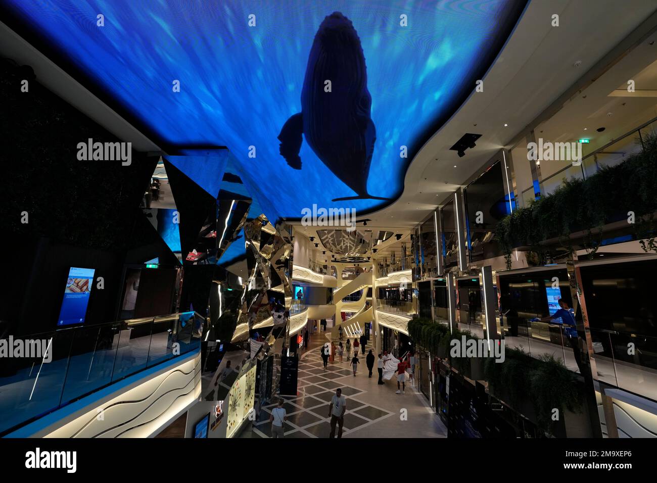 People walk inside the 22-decks cruise ship MSC World Europa, a ...