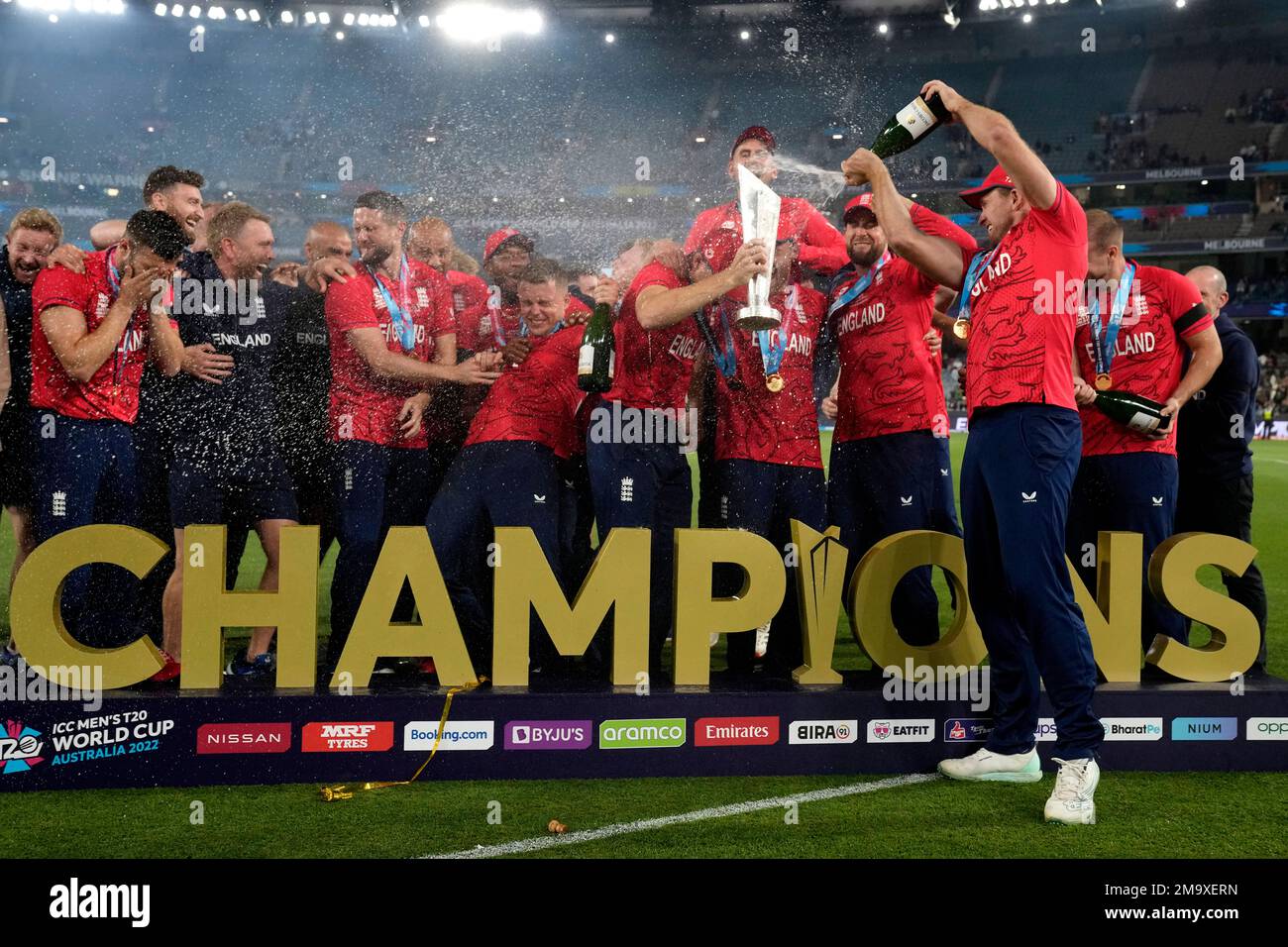 England players celebrate with the winners trophy after their win ...