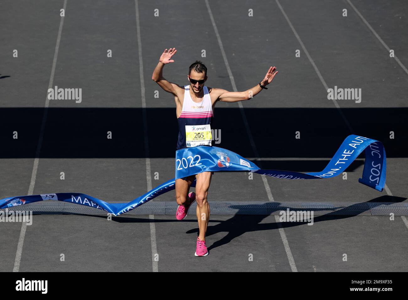 Greek runner Charalampos Pitsolis crosses the finish line to win the ...