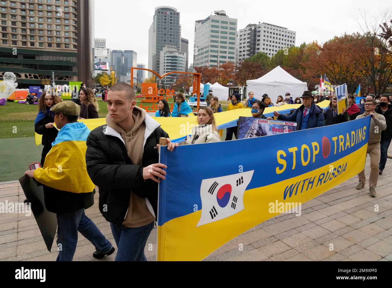 People march during a rally against Russia's invasion of Ukraine, near ...