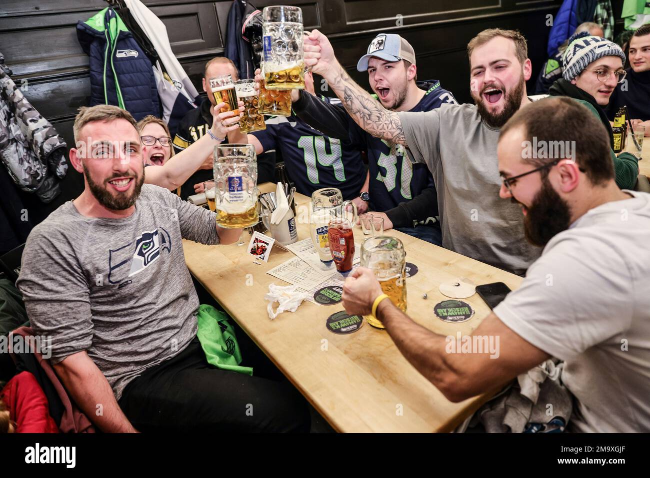 Fans raise a toast as they pose for a photo during the Seattle Seahawks ...