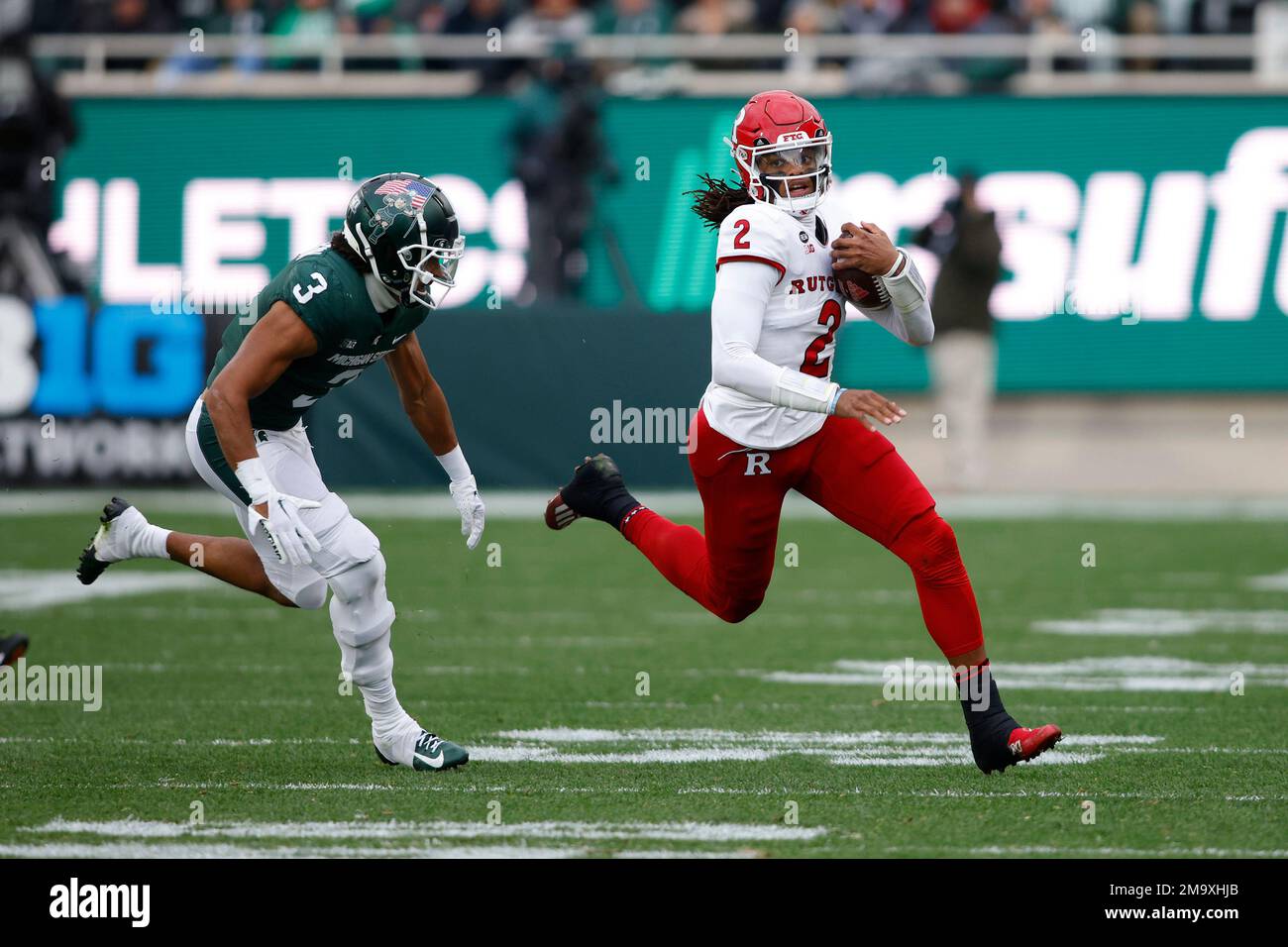 Rutgers quarterback Gavin Wimsatt, right, runs against Michigan State's ...