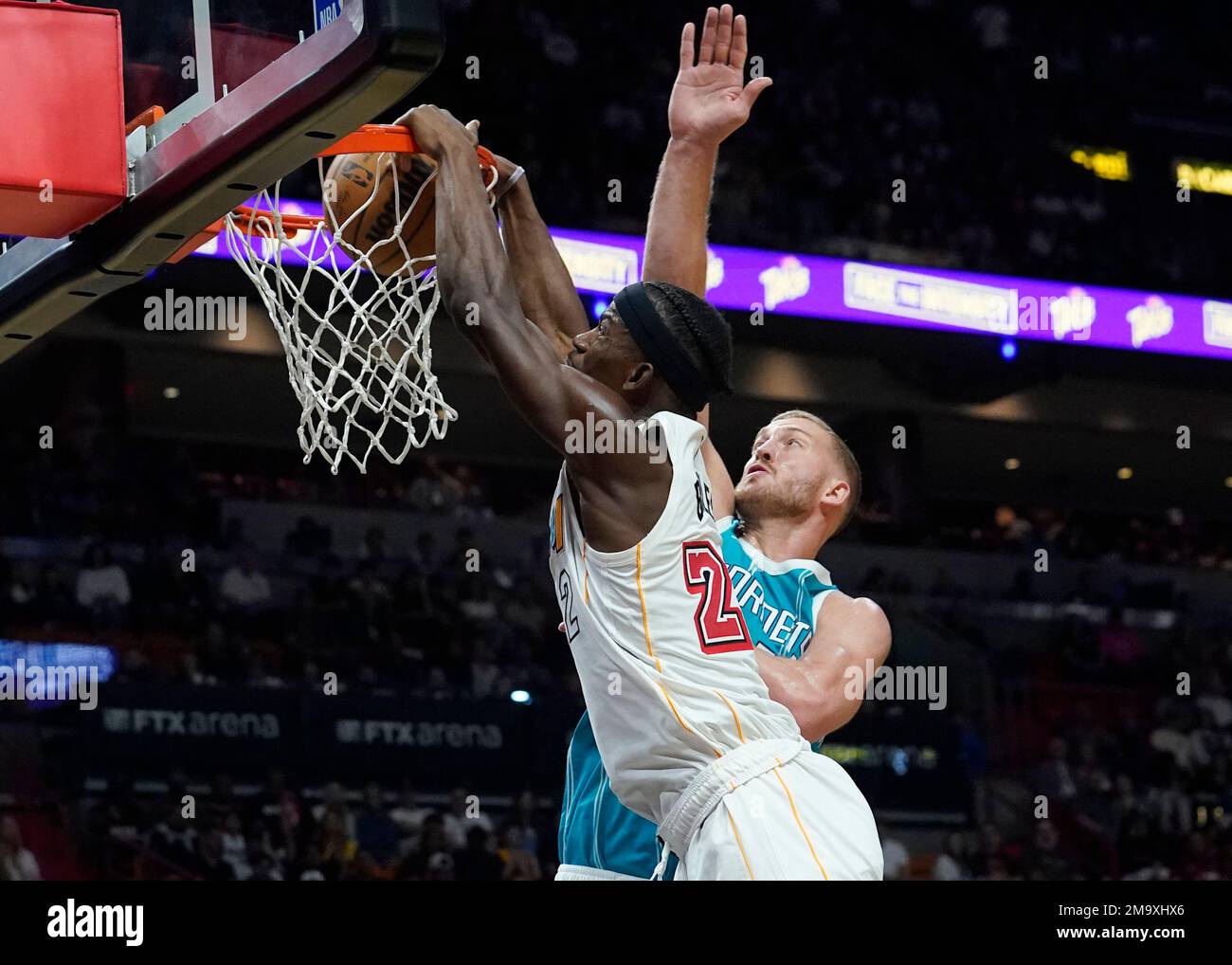 Miami Heat forward Jimmy Butler (22) dunks the ball ahead of Charlotte ...