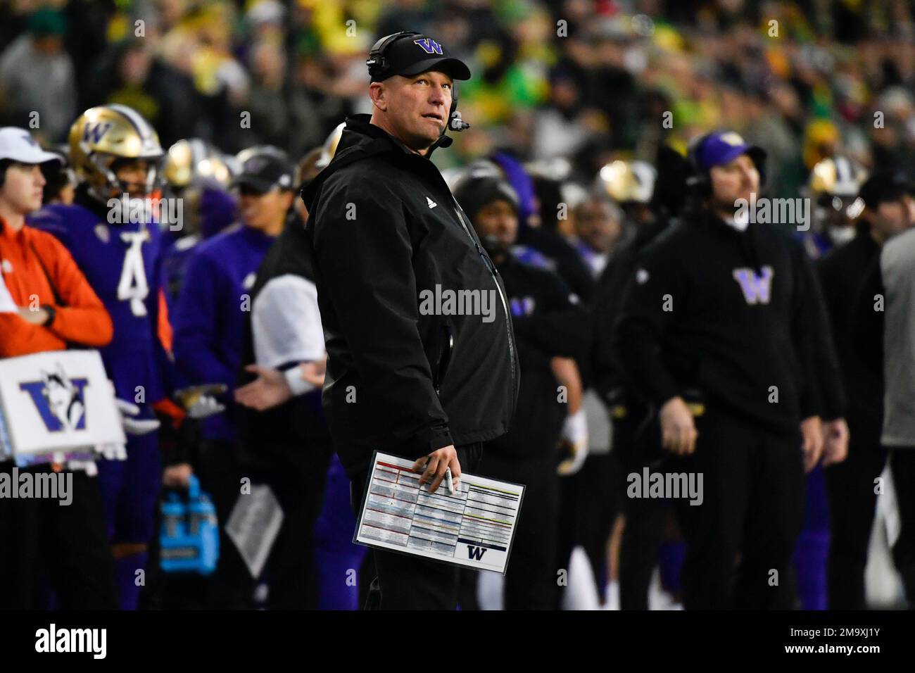Washington head coach Kalen DeBoer, center, watches a replay during the ...