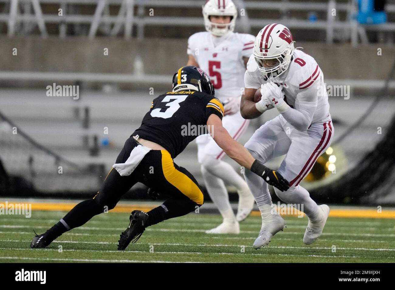 Wisconsin running back Braelon Allen (0) runs from Iowa defensive back ...