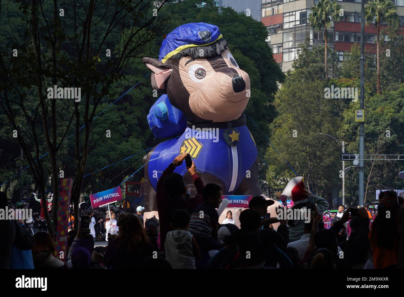 A police dog balloon floats in the Christmas Bolo Fest parade, in ...