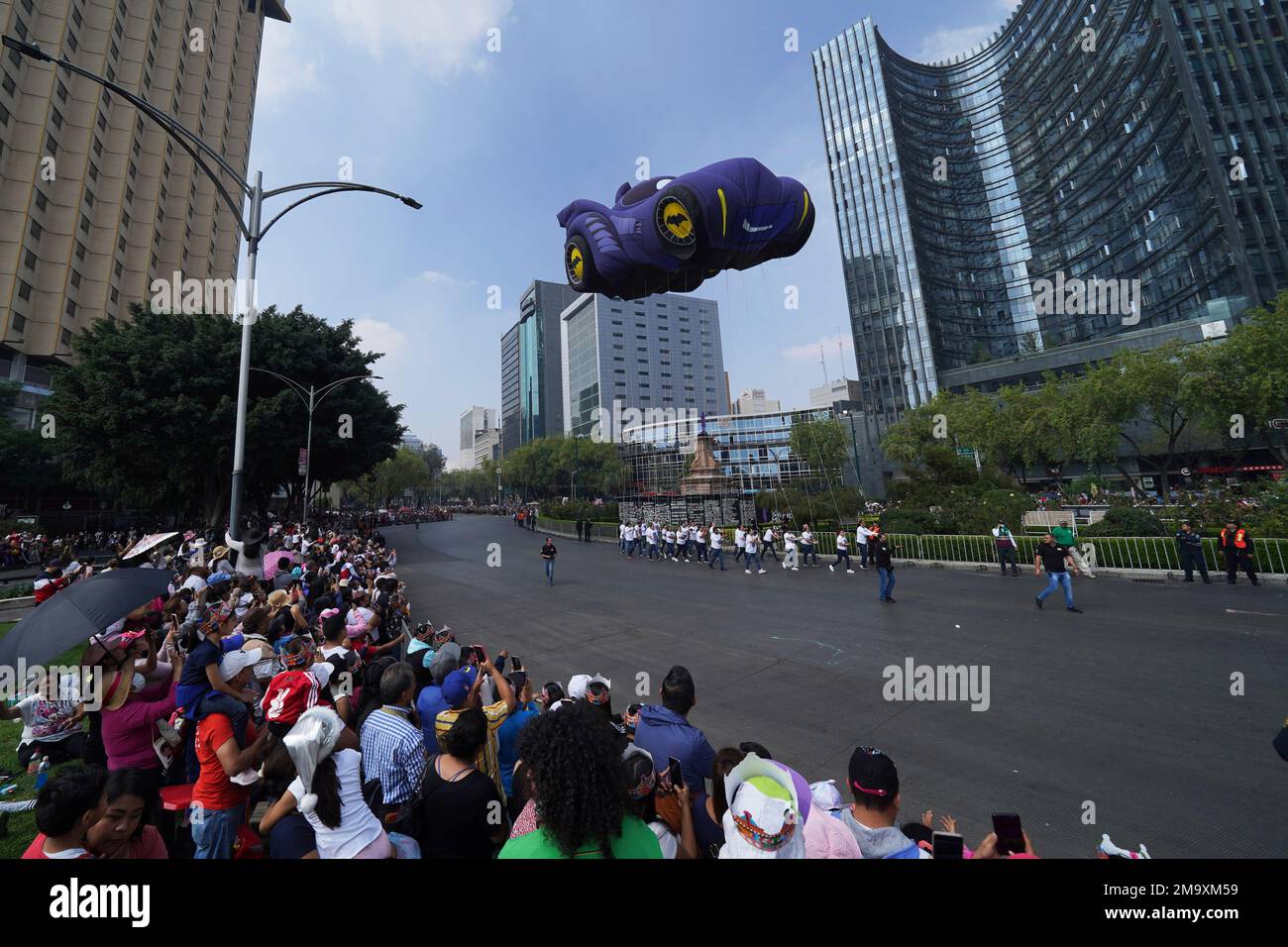 A Batman car ballon floats over spectators lining Reforma Avenue in the ...