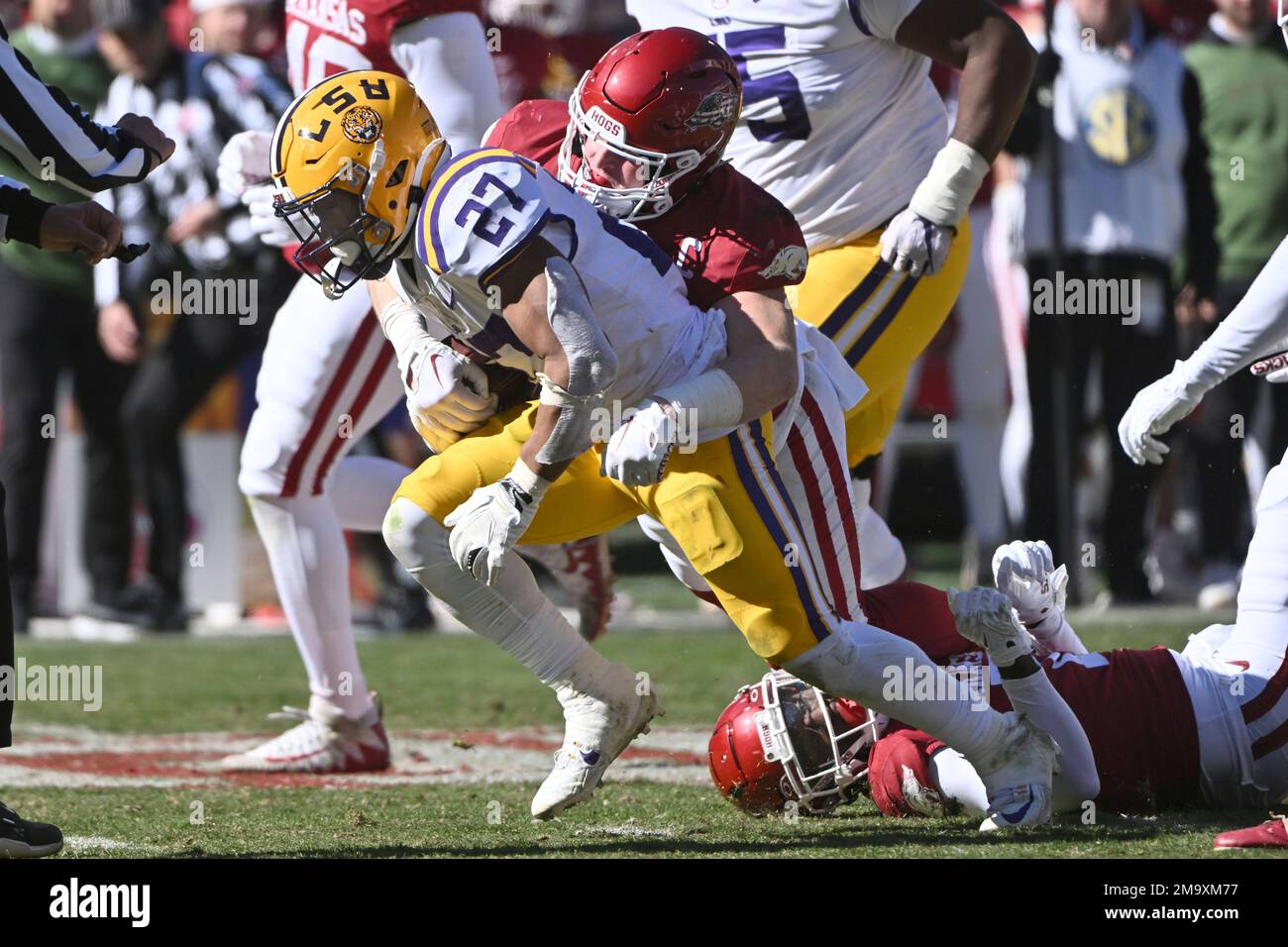LSU running back Josh Williams (27) is tackled by Arkansas linebacker ...