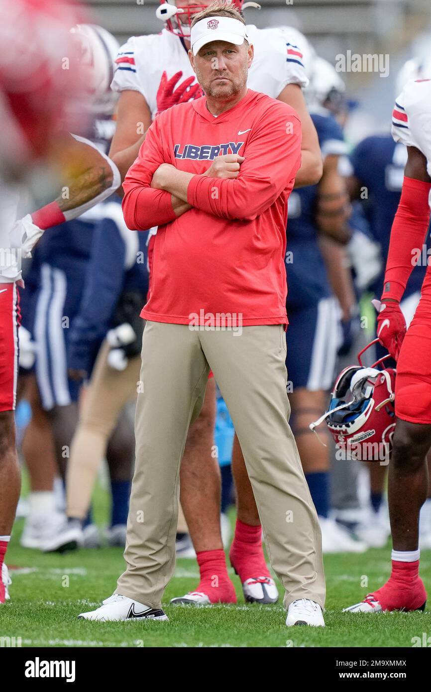 Liberty head coach Hugh Freeze watches as players warm up prior to an ...