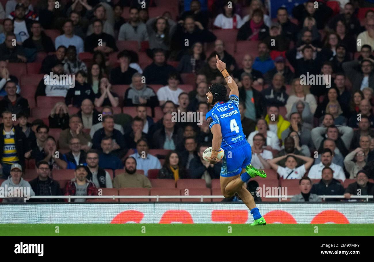 Samoa's Stephen Crichton runs as celebrates on his to score a try ...