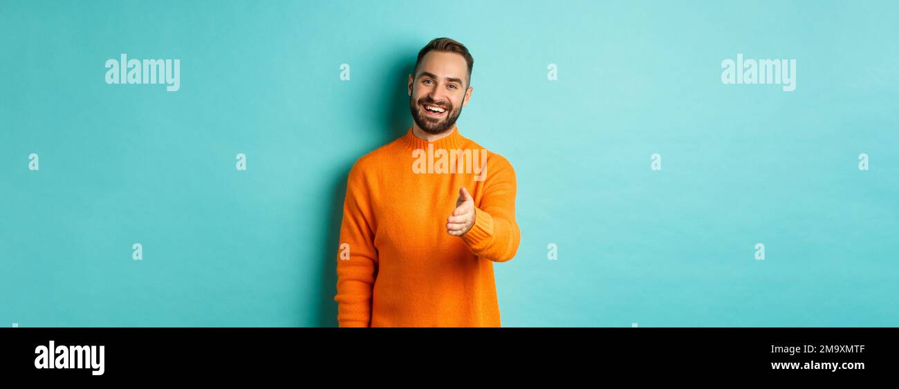 Friendly nice guy extend hand for handshake, greeting you and smiling ...