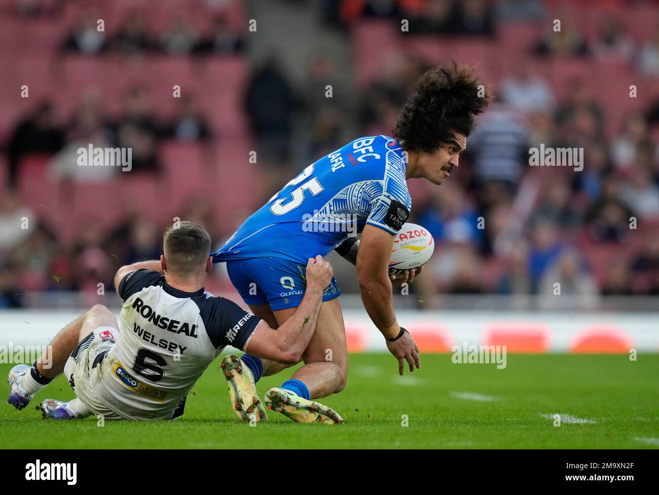 Samoa's Tim Lafai, right, stacked by England's Jack Welsby during the ...