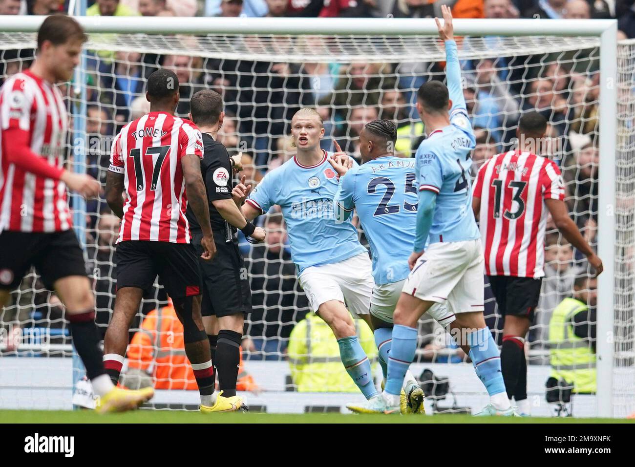 Manchester City's Erling Haaland, center, argues with referee Peter ...