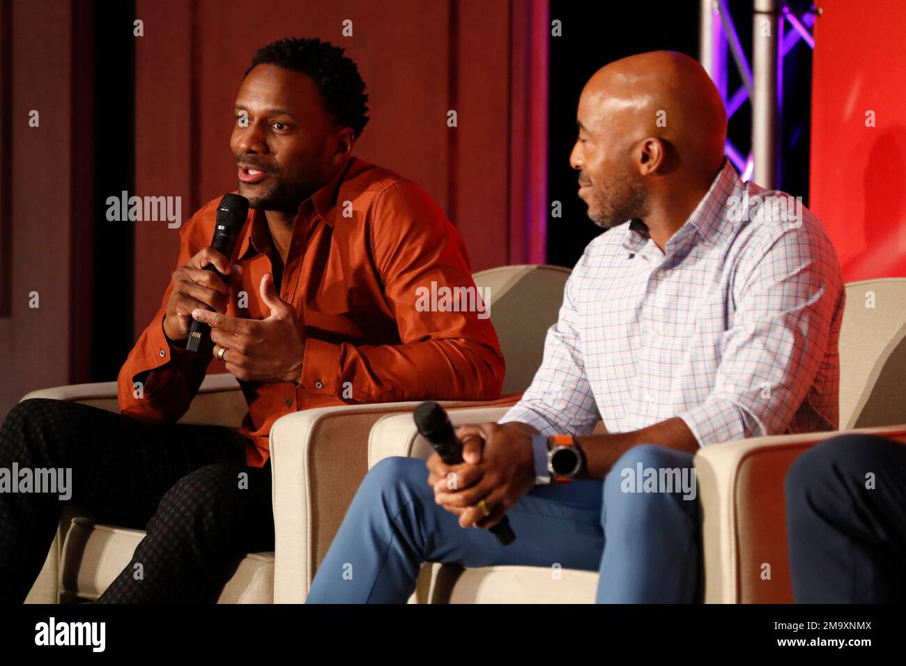 Former NFL player Jordan Babineaux, left, speaks on stage at the NFL ...
