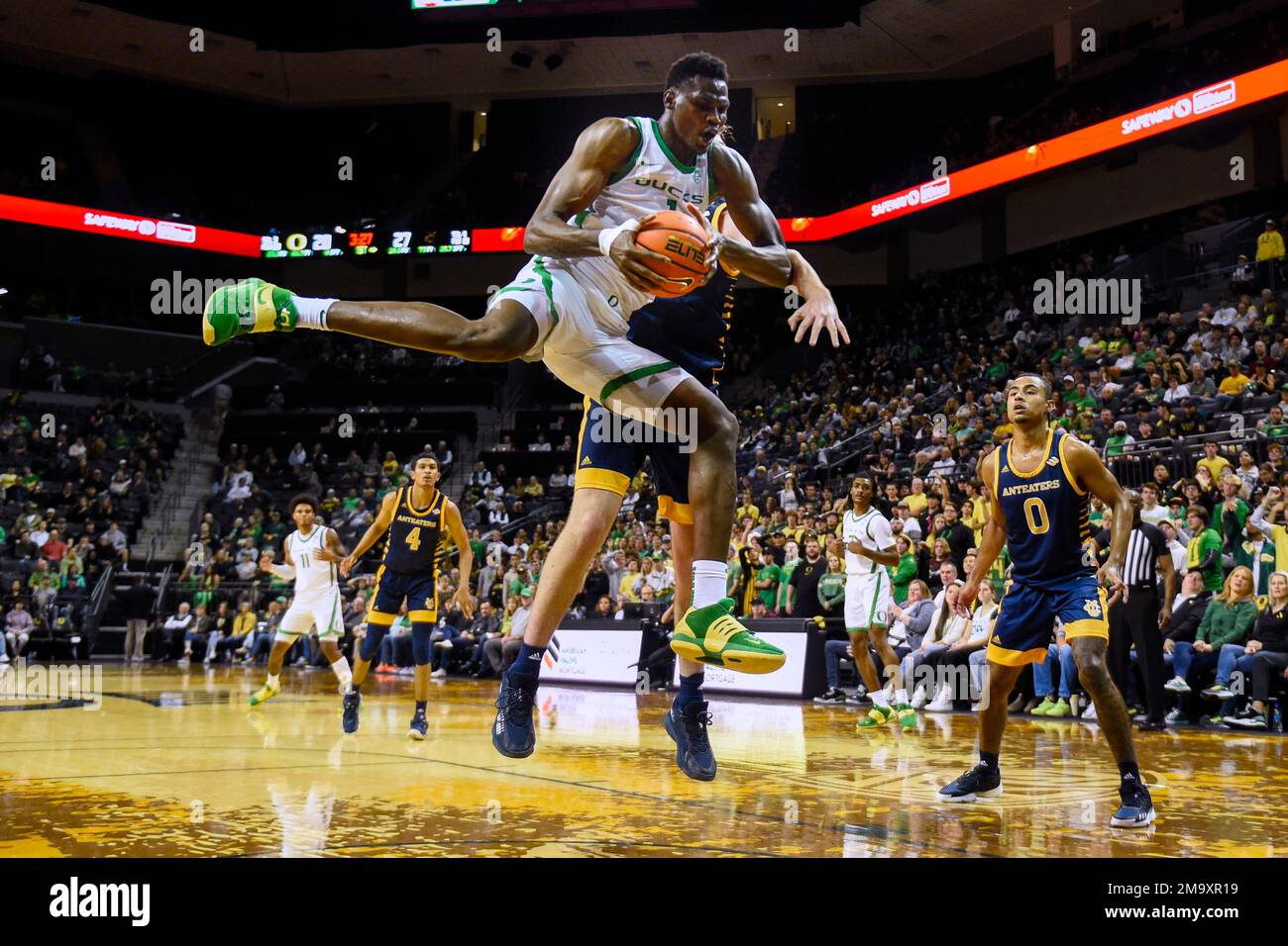 Oregon center N'Faly Dante (1) hauls in a rebound in front ot UC Irvine ...