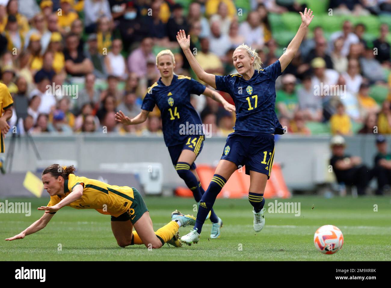 Australia's Hayley Raso, left, is tripped up by Sweden's Emma Kullberg ...