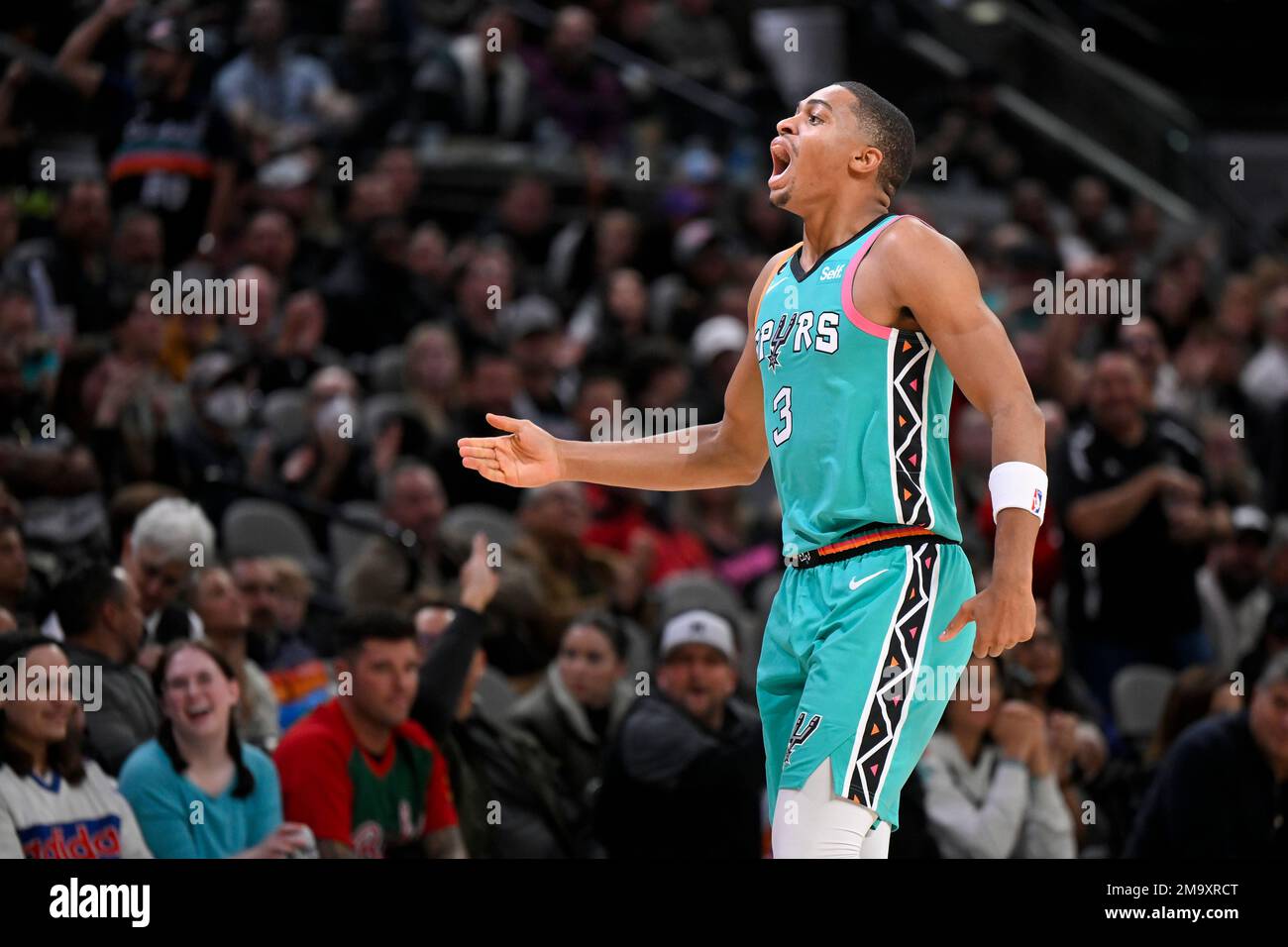 San Antonio Spurs' Keldon Johnson celebrates a three-point basket ...