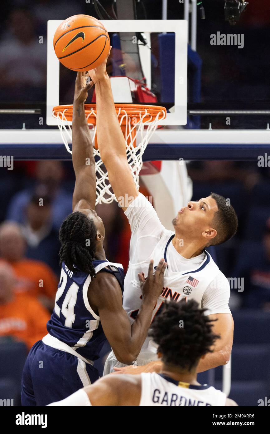 Virginia's Kadin Shedrick (21) blocks a shot against Monmouth during ...