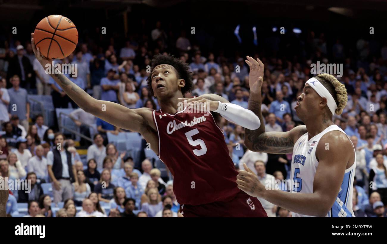College of Charleston forward Raekwon Horton, left, drives against ...