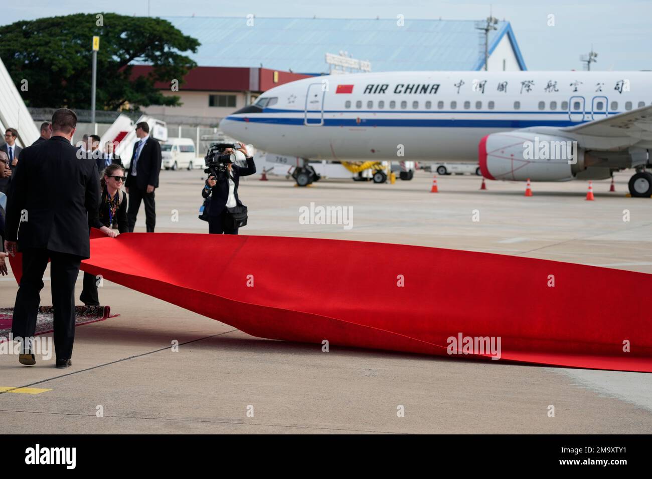 A red carpet is rolled out as President Joe Biden arrives on Air Force One, Saturday, Nov. 12 ...