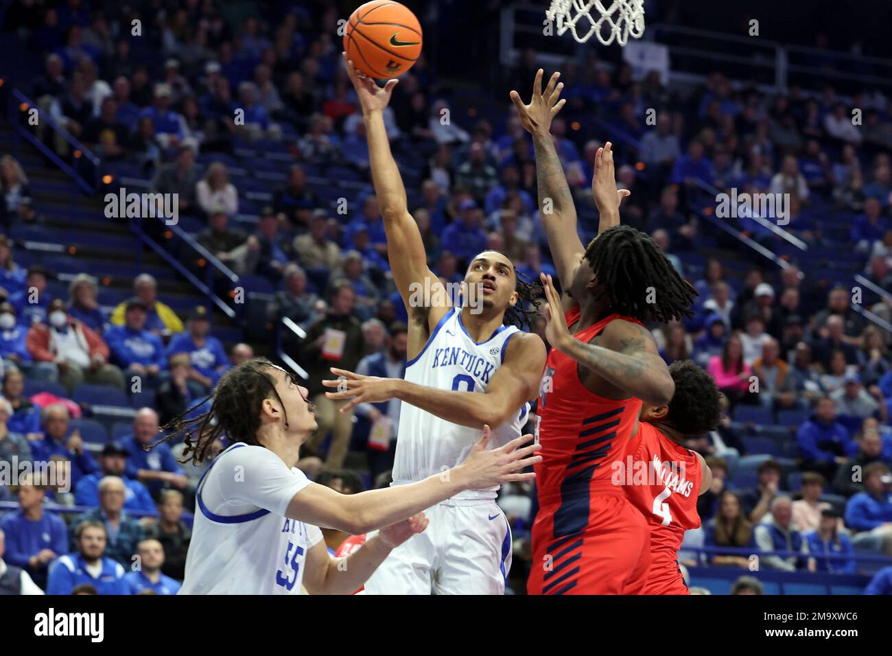 Kentucky's Jacob Toppin (0) shoots while defended by Duquesne's Tre ...