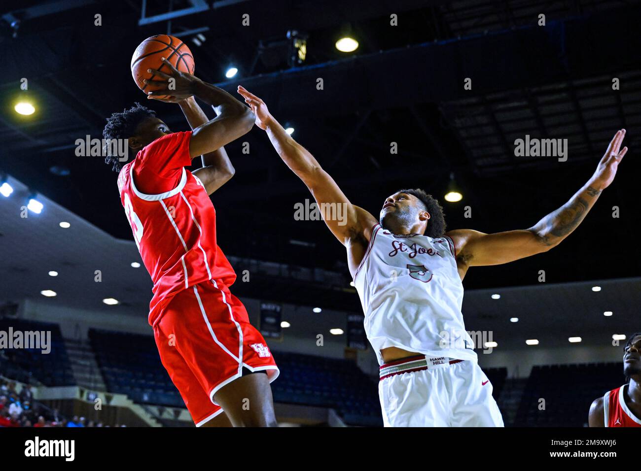 Houston guard Terrance Arceneaux shoots over Saint Joseph's guard Lynn ...