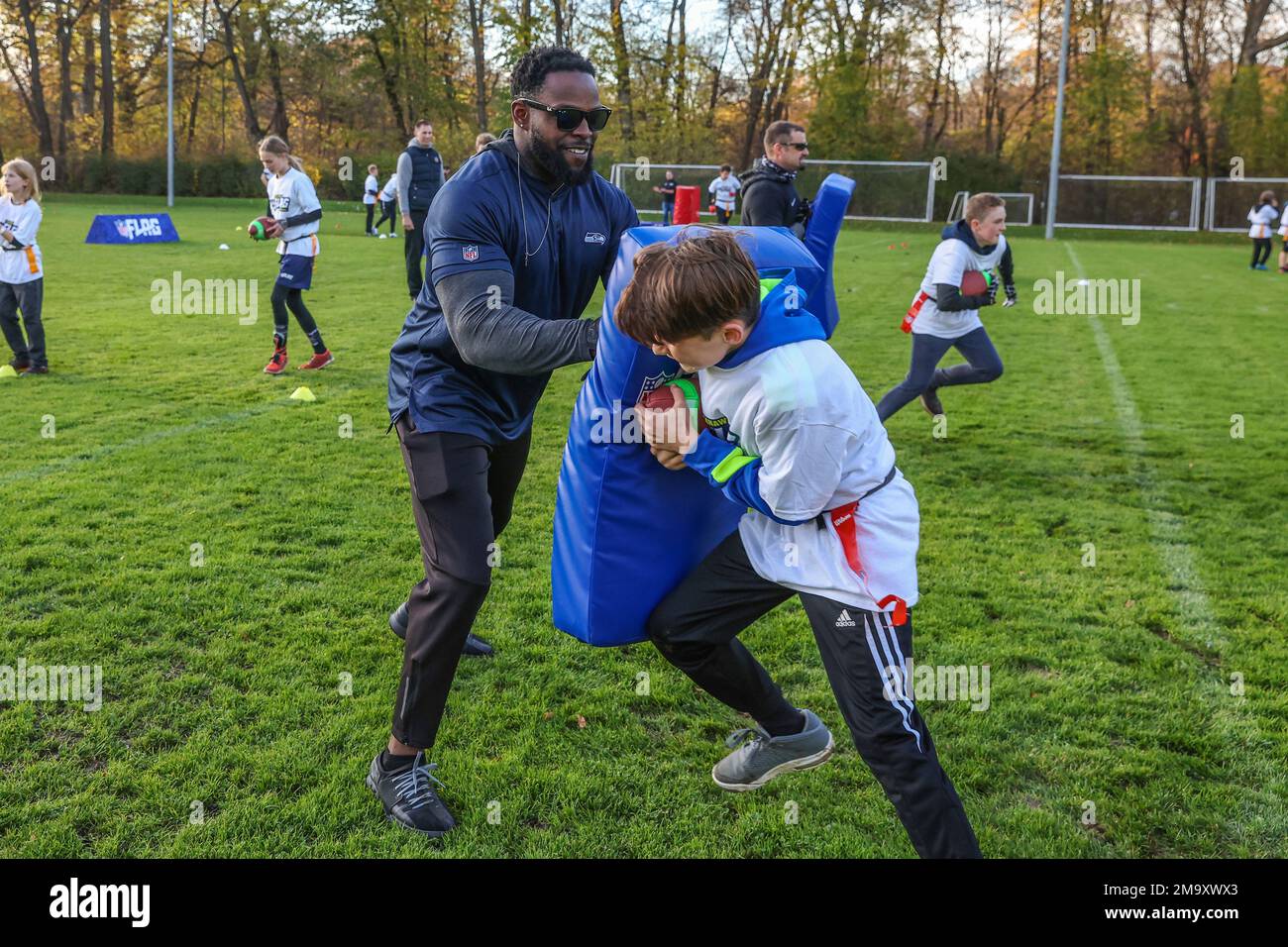 Seattle Seahawks alumnus Robert Turbin coaches youth participating in ...