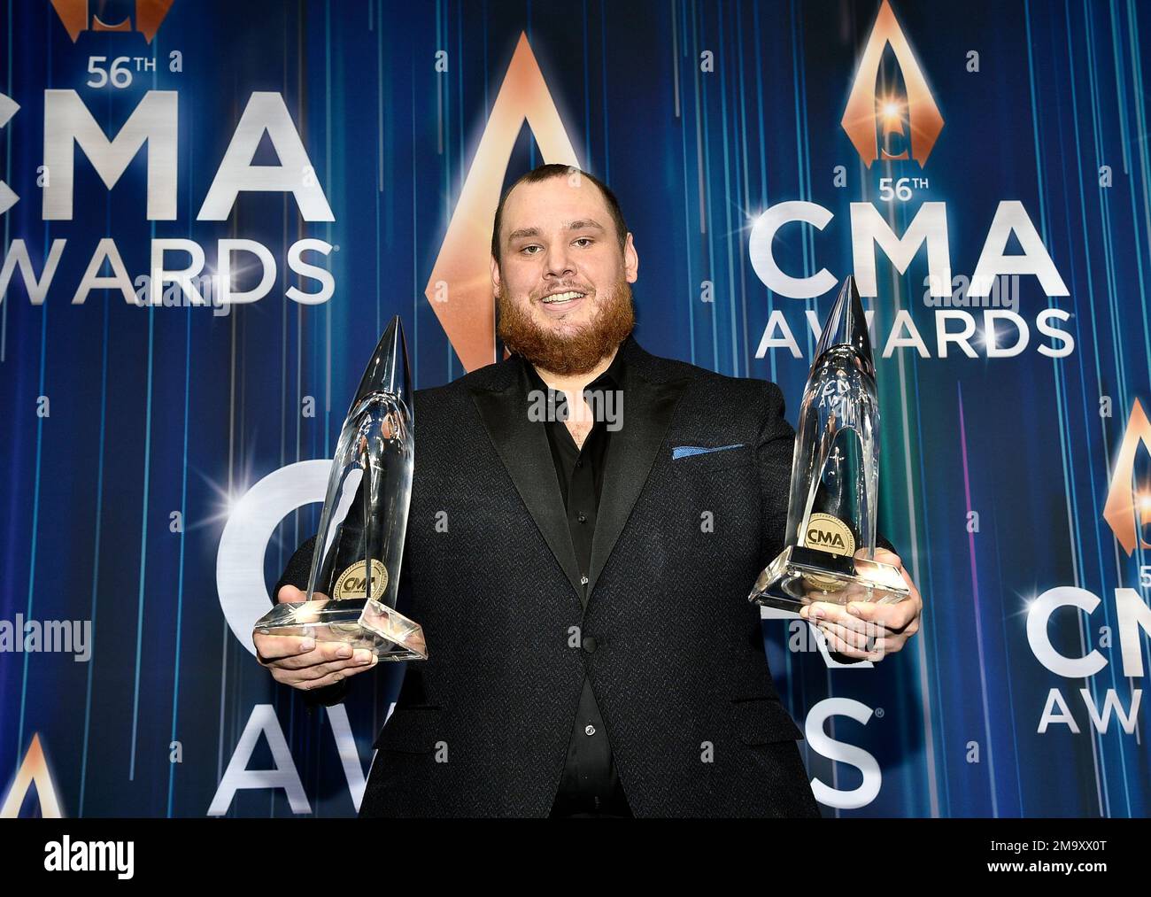 luke-combs-poses-in-the-press-room-with-the-awards-for-album-of-the