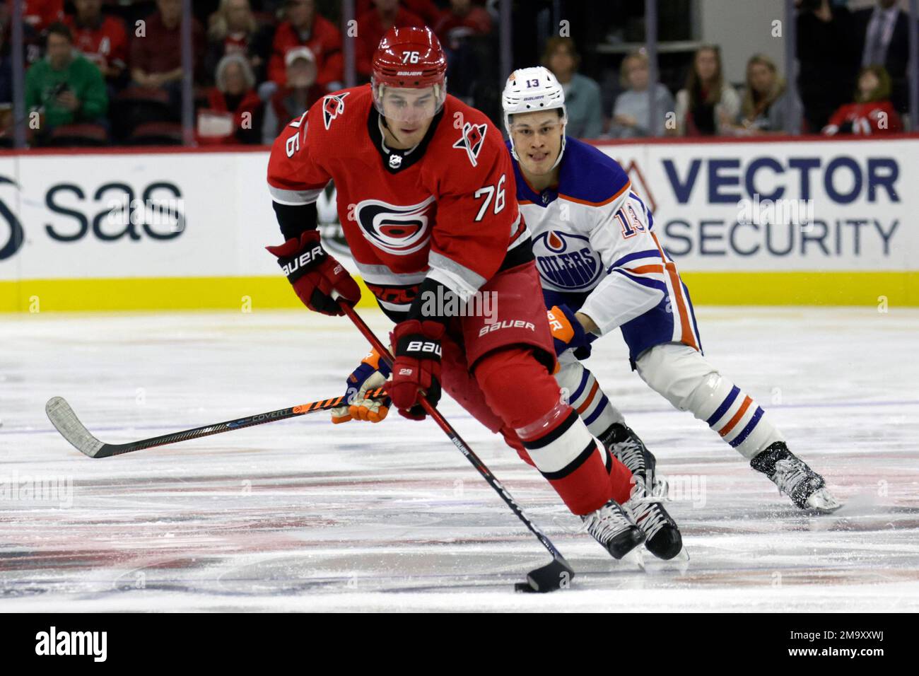 Carolina Hurricanes defenseman Brady Skjei (76) adavances the puck past Edmonton Oilers right ...