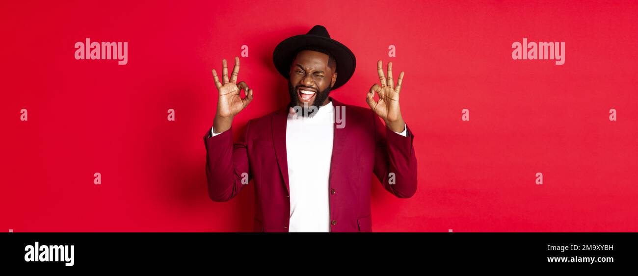 Christmas shopping and people concept. Handsome Black man showing ok ...