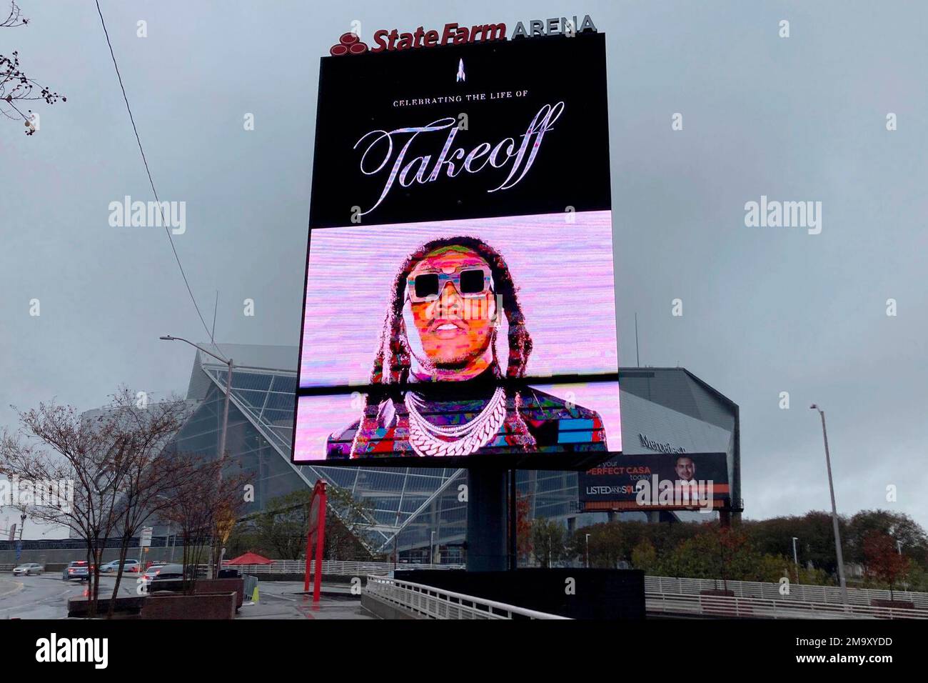 A sign announces the memorial service for slain rapper Takeoff at ...