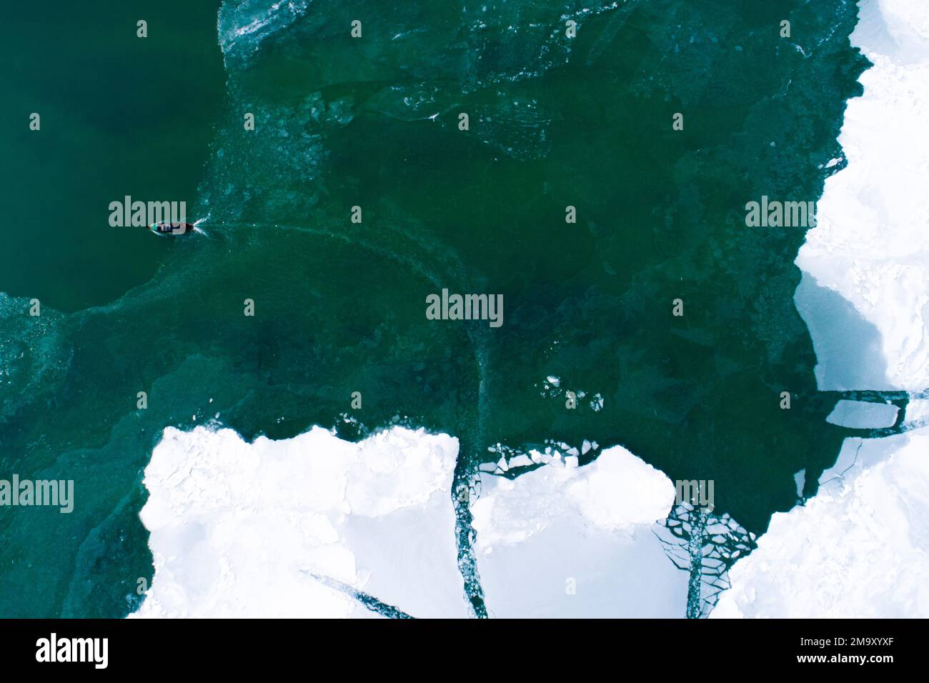 Cracking Ice Expedition Boat Exploration on a Shattered Ice Sheet Stock ...