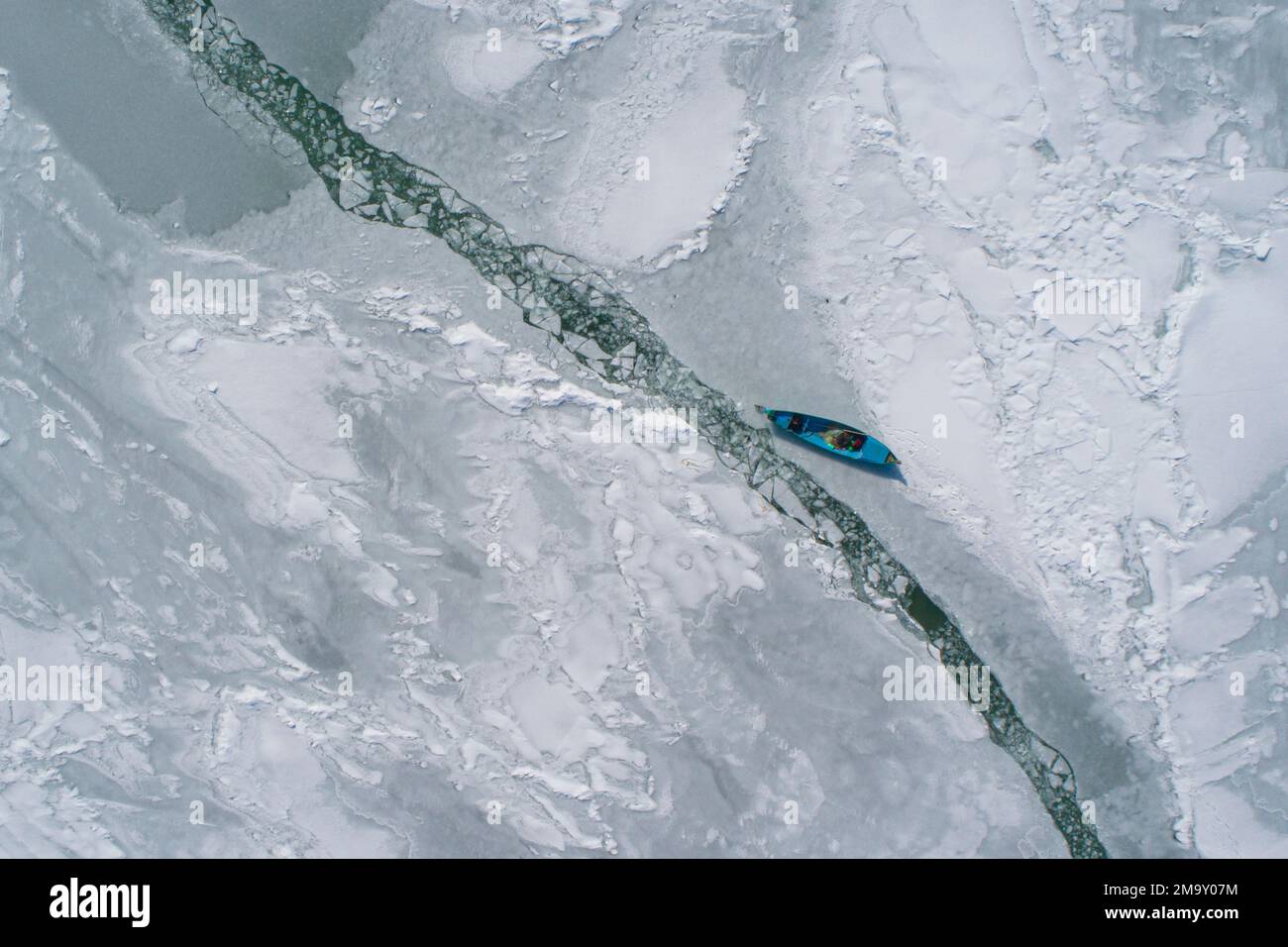 Cracking Ice Expedition Boat Exploration on a Shattered Ice Sheet Stock ...