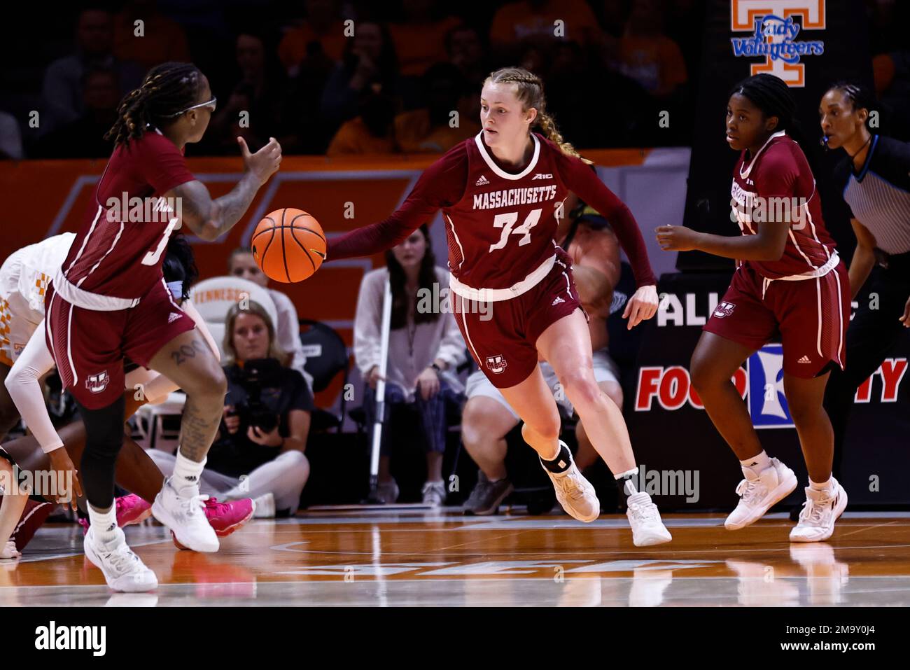 UMass forward Sam Breen (34) drives the ball up court during the first ...